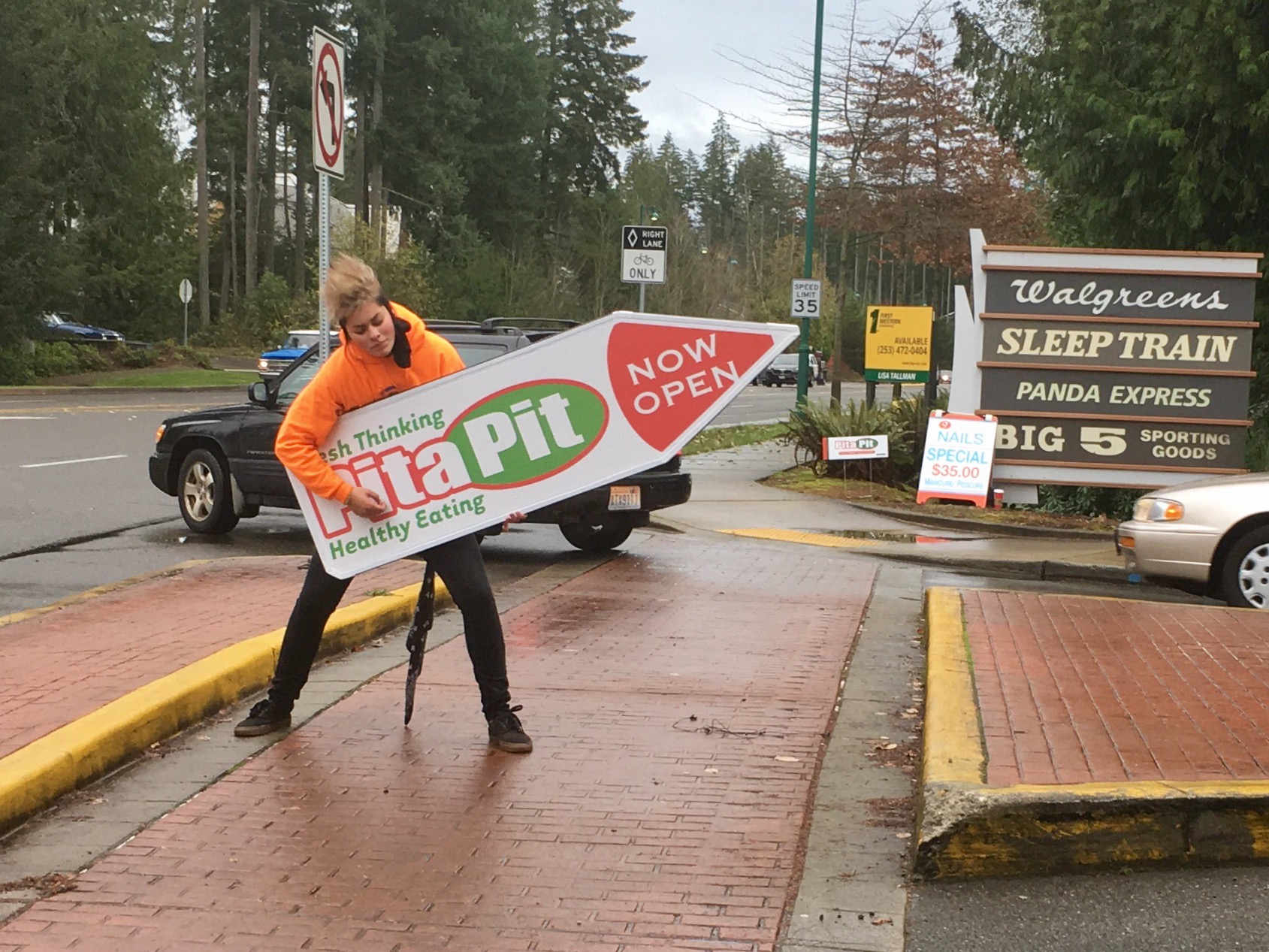 Sign Spinner Ads Promotes Pita Pit Grand Opening – Sign Spinner Advertising